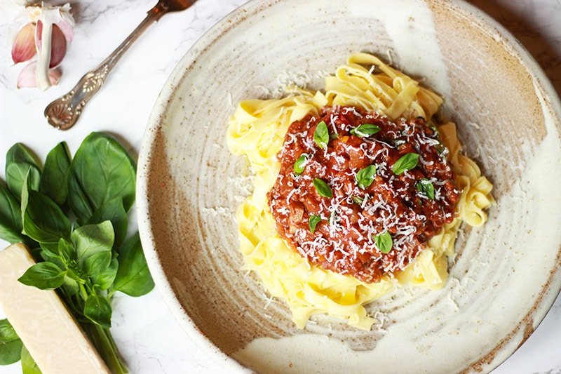A lusciously, rich and tomatoey slow cooker Ragu, served with a mound ...