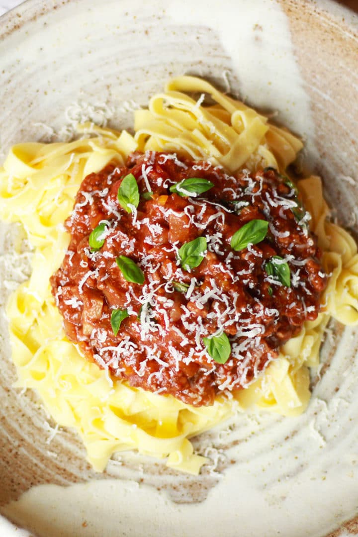 A lusciously, rich and tomatoey slow cooker Ragu, served with a mound ...